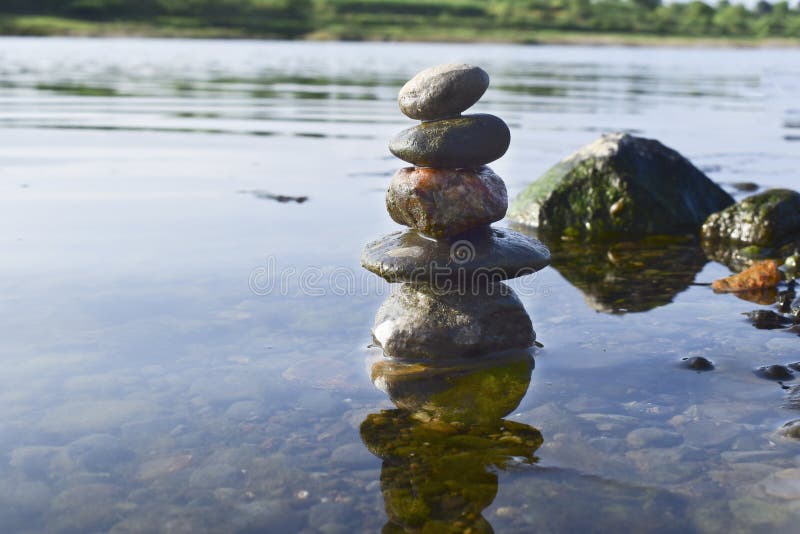 A Stone Pyramid in the Water by the River Stock Image - Image of ...