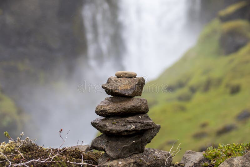 A Stone Pyramid at a Waterfall in Iceland Stock Photo - Image of ...