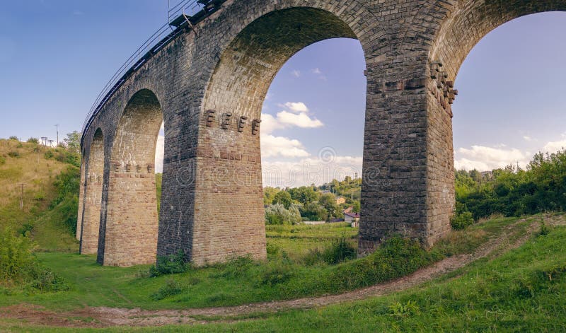 Stone Railway Ancient Arch Bridge Over the Green Valley Stock Image ...