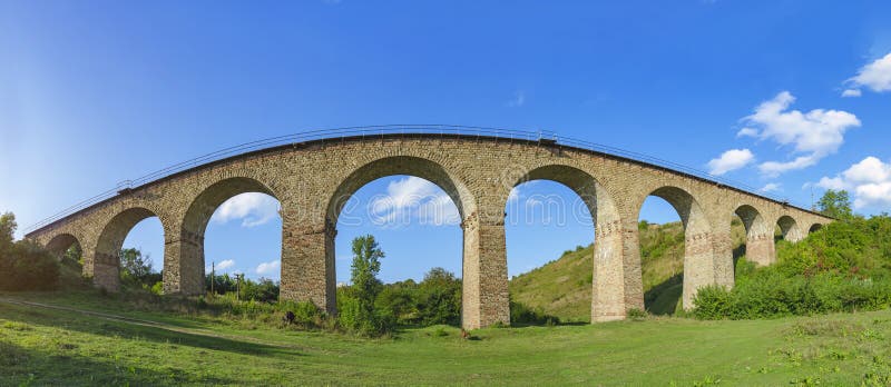 Stone Railway Ancient Arch Bridge Over the Green Valley Stock Photo ...