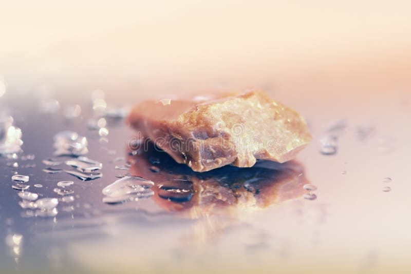 Beautiful Stones on a Reflective Surface Stock Photo - Image of orange ...