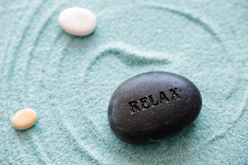 Stone Relax on a blue sand stock photo. Image of calmness - 20743862