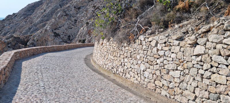 Stone Road To Ancient Thera in Santorini Stock Photo - Image of hill ...