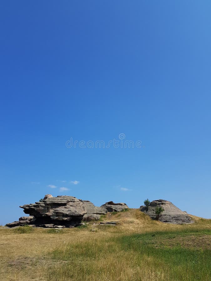 Stone rocks in the steppe stock image. Image of mountain - 192336913