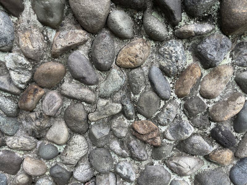 Stone Rolled into the Wall. Wall Covering Stock Photo - Image of ...