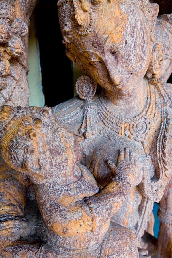 Stone Sculpture of a Mother Holding a Baby Stock Image - Image of ...