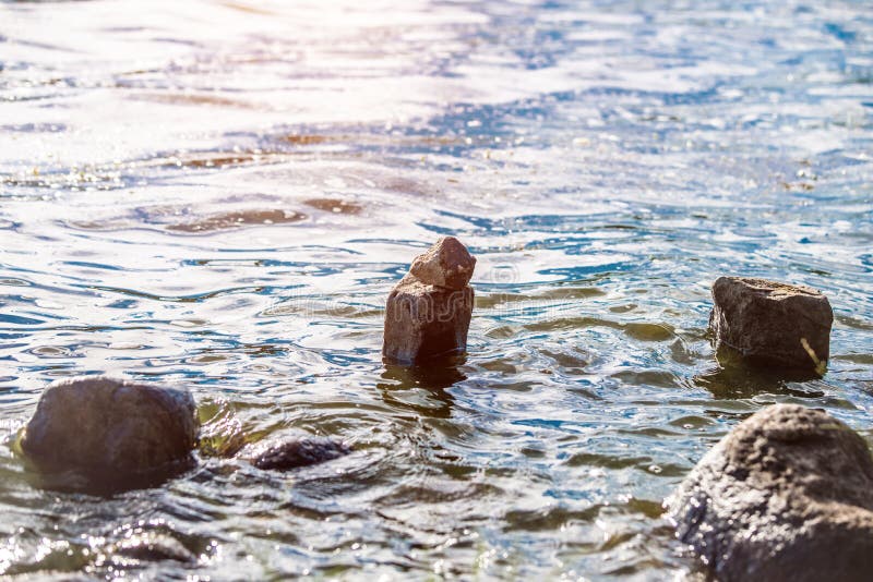 A stone sculpture stands stock photo. Image of rock - 214836952