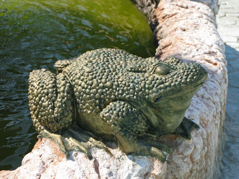 Stone sculpture of a toad stock photo. Image of figure - 58671698