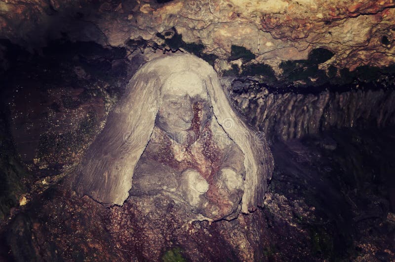 Stone Sculpture of Troll with a Spring Flowing from His Eyes Stock ...