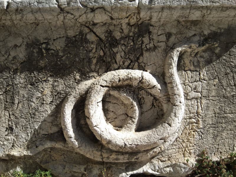 Stone Sculptured Statue of a Snake on Grunge Stone Wall Stock Image ...