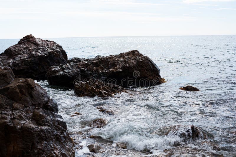 Stone in the sea or ocean stock photo. Image of beach - 62241488