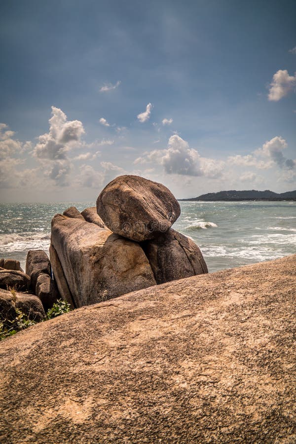 Stone in sea with wave stock photo. Image of thailand - 68484502