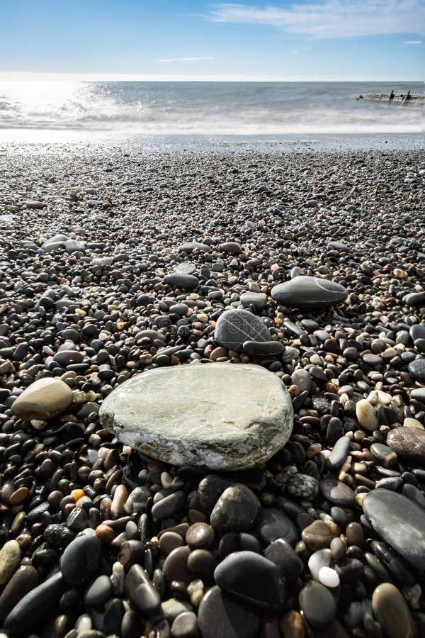 A Stone on the Seashore on a Pebble Beach Stock Image - Image of wave ...