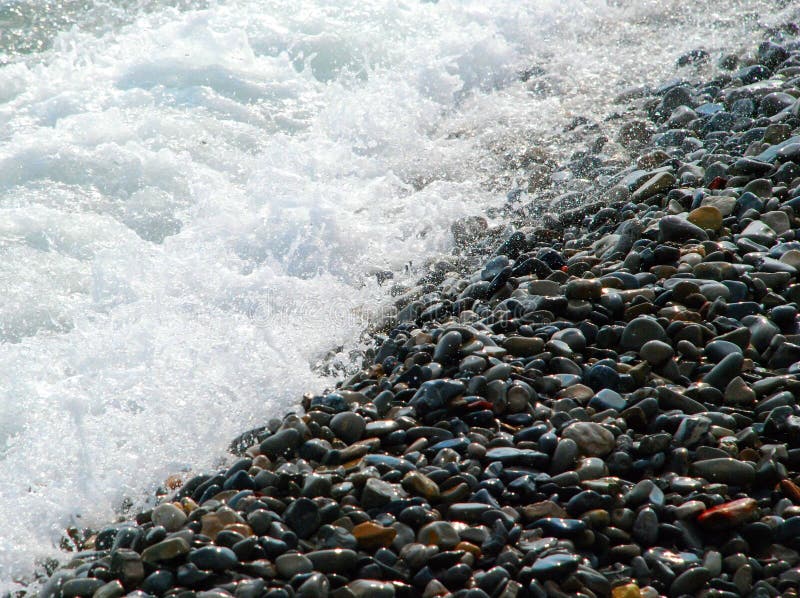 Stone seashore with surf stock photo. Image of stony - 238055388