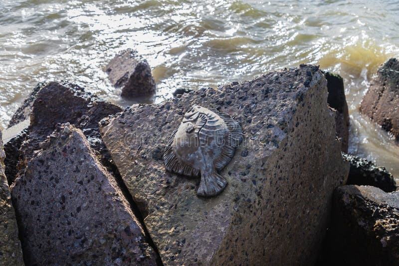 Stone-shaped cement fish stock image. Image of rock - 139995371
