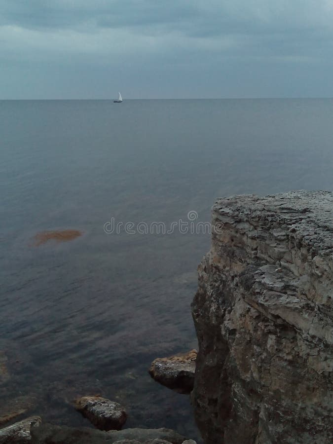 Stone shore gray seascape stock image. Image of clouds - 80970679