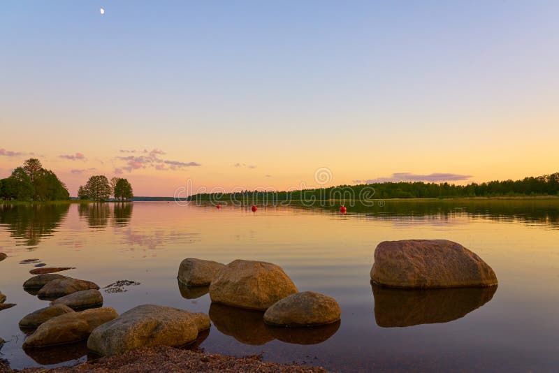 The Stone Shore of the Lake at Sunset. Stock Image - Image of stone ...