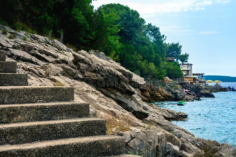 Stone slope on the beach stock photo. Image of beautiful - 227269480