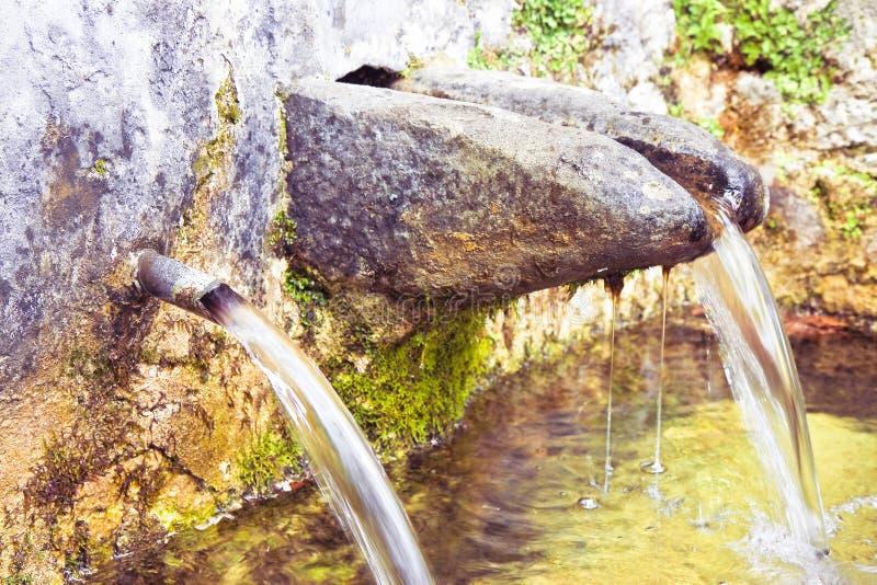 Stone Source of Drinking Water Comes from a Mountain - Image with Copy ...