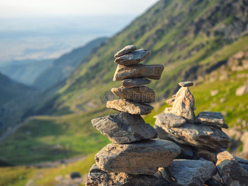 Stone Stack with Balanced Stones on Blurred Mountain Background in ...