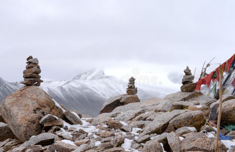 Stone Stack on the Top of Hill with Snow Mountain Landscape Background ...
