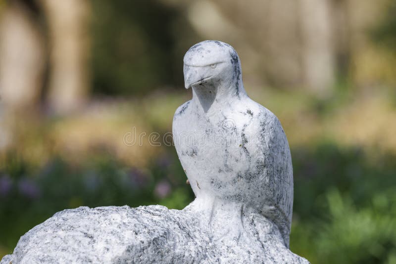 A stone statue of bird stock image. Image of face, cemetery - 252523797