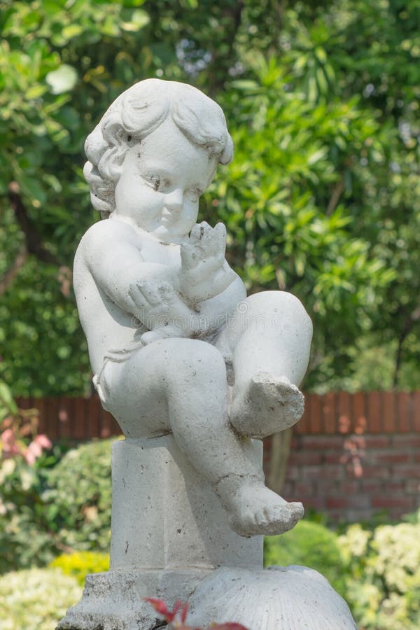 Stone statue stock photo. Image of funeral, cherub, background - 47754892
