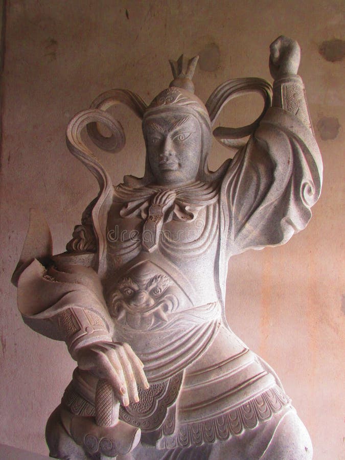 Stone Statue of a Dharma Protector in the Temple. Stock Photo - Image ...