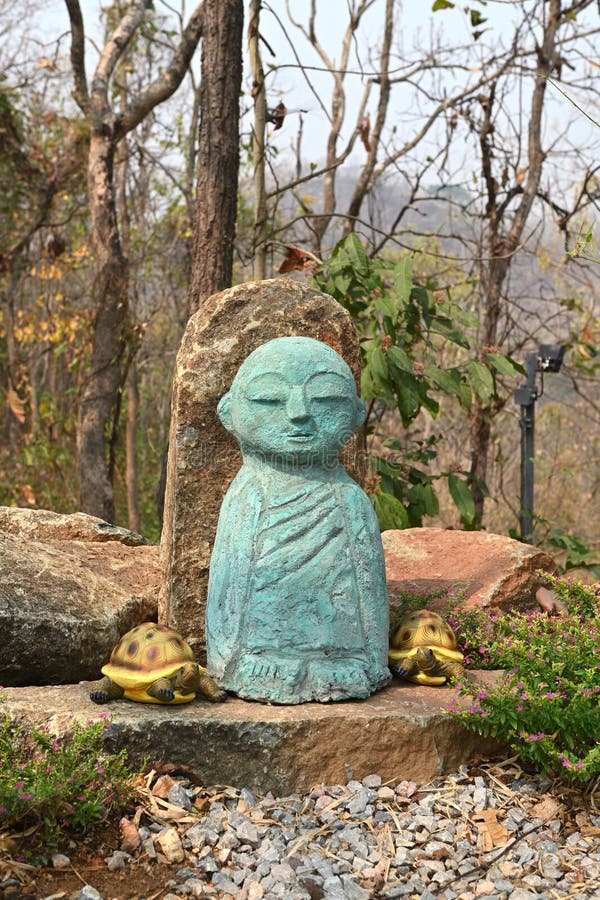 Stone Statue of a Little Monk at a Temple in Thailand Stock Photo ...