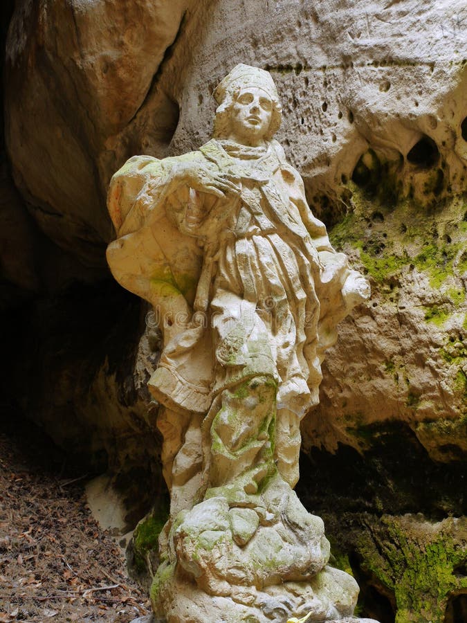 Stone statue in the rocks. stock photo. Image of rock - 32341696