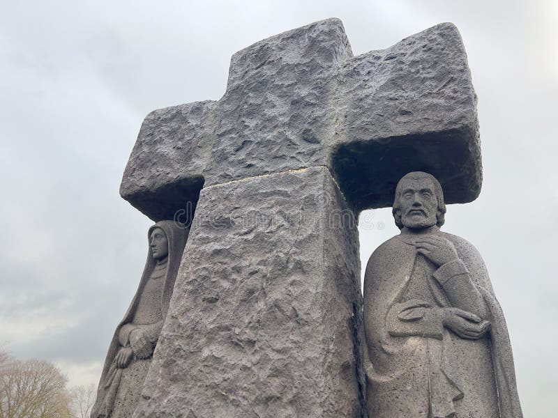 Religious Stone Statues with Cross and Cloudy Sky. Stock Image - Image ...