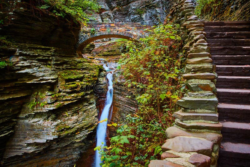 Stone Steps Along Gorge with Stone Arch Walking Bridge and Waterfalls ...