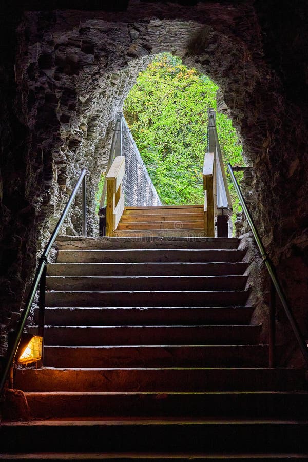 Stone Steps in Dark Cave Tunnel Leading To Exit with Green Forest Stock ...