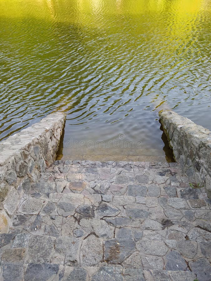 Stone steps to the lake stock photo. Image of sand, asphalt - 189594522