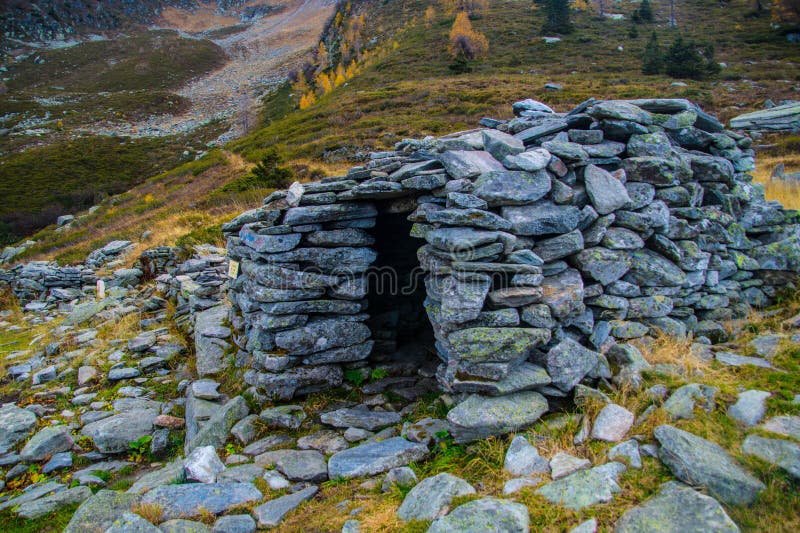 A Stone Structure Sits in the Middle of a Field Covered in Rocks Stock ...