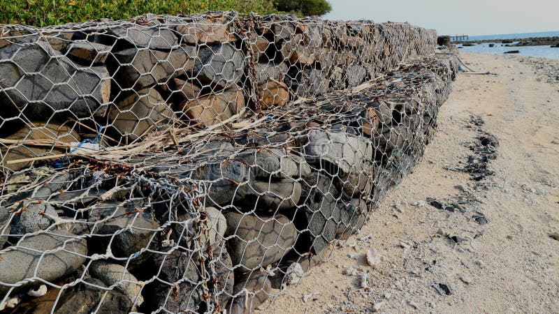 The Stone Structure in the Wire To Resist Beach Abrasion Stock Image ...
