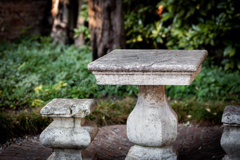 Stone Table and Stools in a Romantic Garden of an Ancient Palace Stock ...
