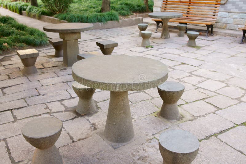 Stone tables and chairs stock image. Image of table, design - 23698879