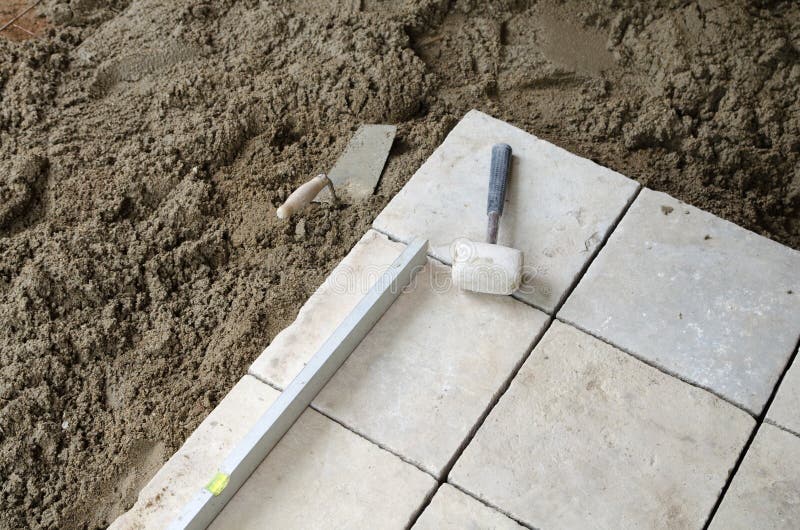 Stone tiles installation stock image. Image of stony - 26322773