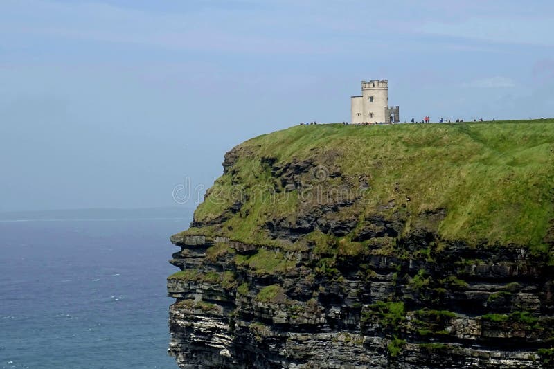 Stone Tower on the Green Cliff Against the Background of a Sky. Cliffs ...