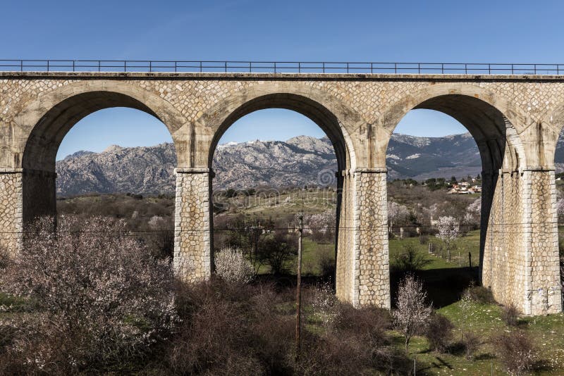 Stone Train Bridge with Views of the Madrid Mountains Stock Photo ...