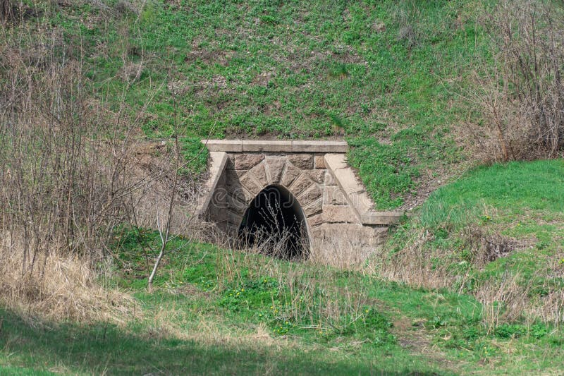 Stone Tunnel with Pointed Arch in Green Hill. Strong Stonework. Stock ...