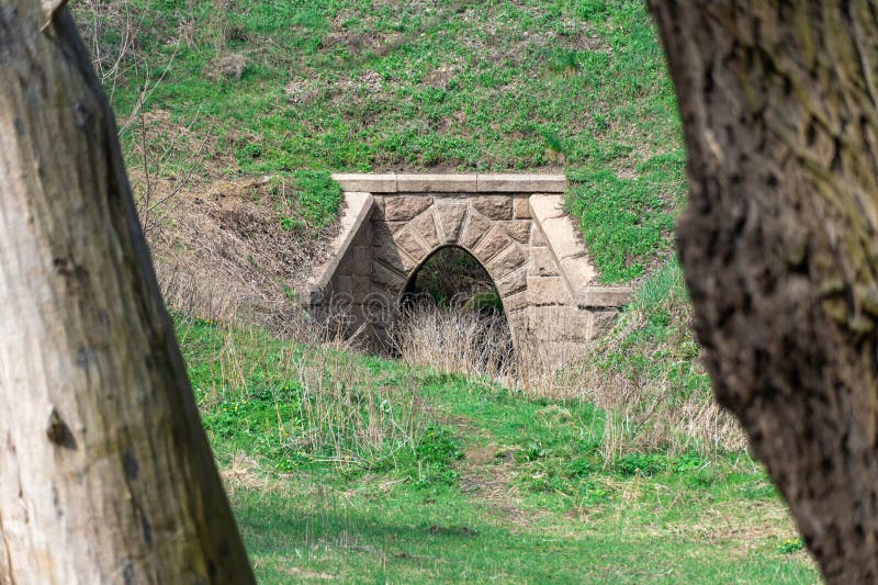 Stone Tunnel with Pointed Arch in Green Hill. Strong Stonework. Stock ...