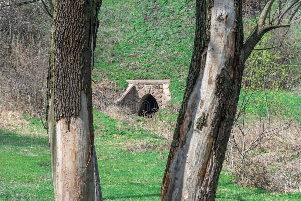 Stone Tunnel with Pointed Arch in Green Hill. Strong Stonework. Stock ...