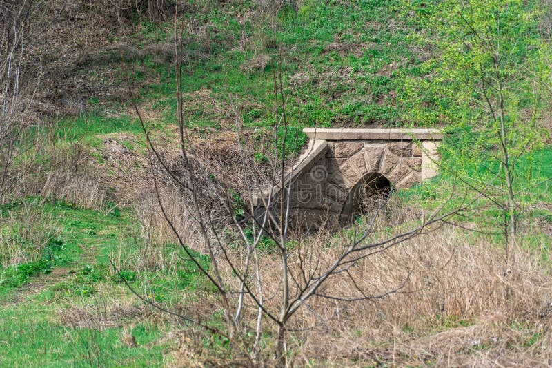 Stone Tunnel with Pointed Arch in Green Hill. Strong Stonework. Stock ...