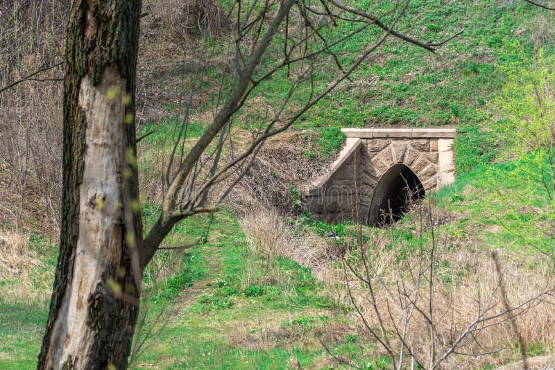 Stone Tunnel with Pointed Arch in Green Hill. Strong Stonework. Stock ...