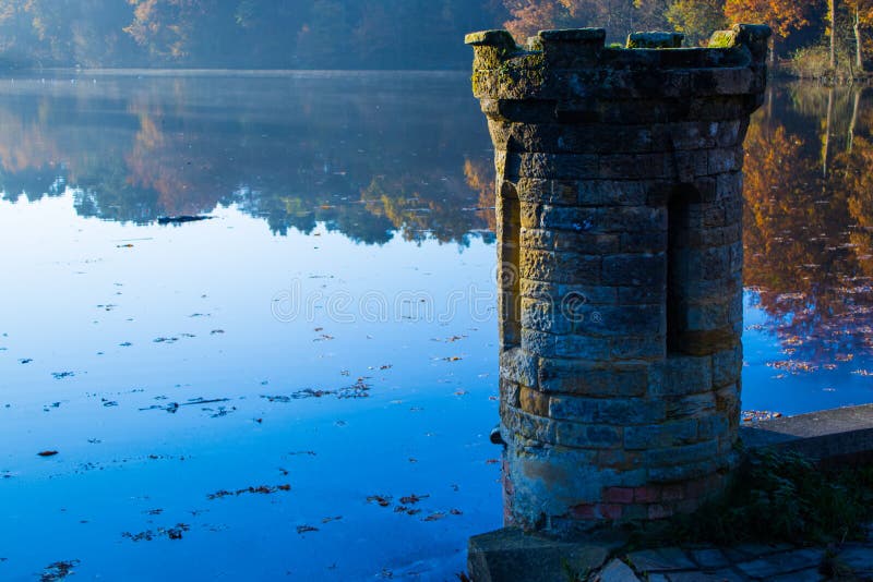 Stone Turret by a Mirror Lake Stock Photo - Image of nature, colorful ...