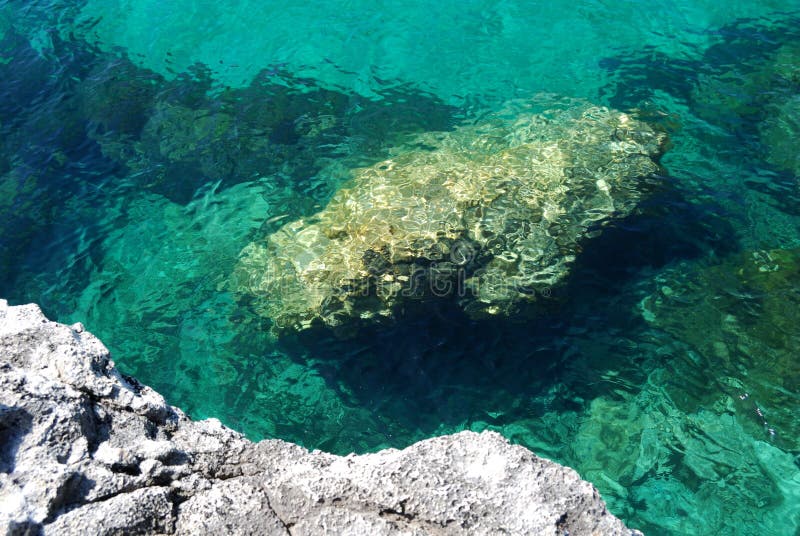 A stone under the sea stock photo. Image of resort, wave - 14303102