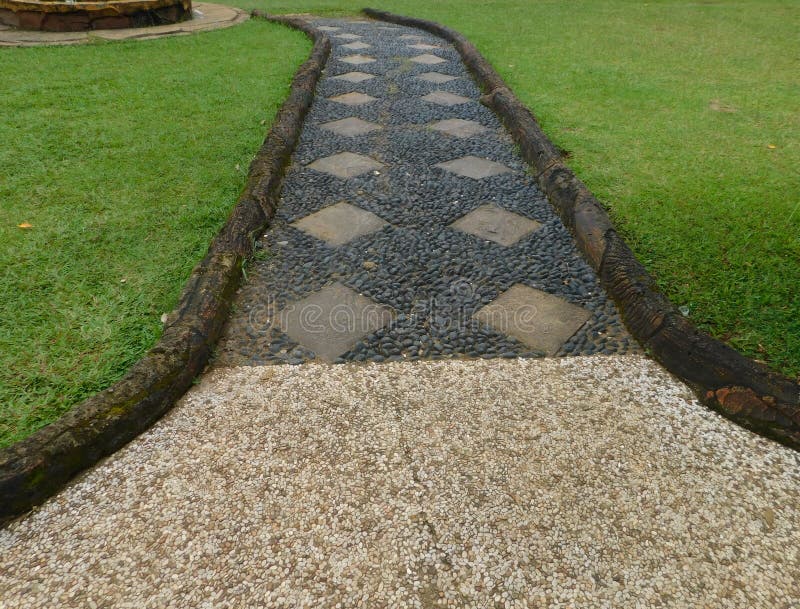 Stone Walkway in Green Playground Stock Image - Image of garden, floor ...