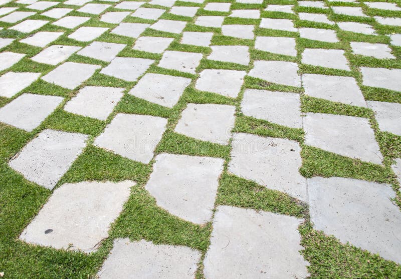 Stone Walkway Pattern on a Grass Field in Perspective View Stock Photo ...